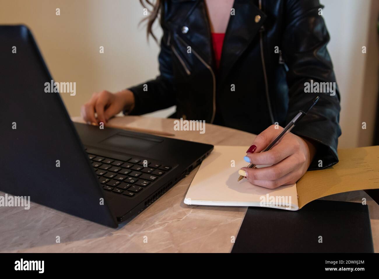 Young woman writes in a book hi-res stock photography and images - Alamy