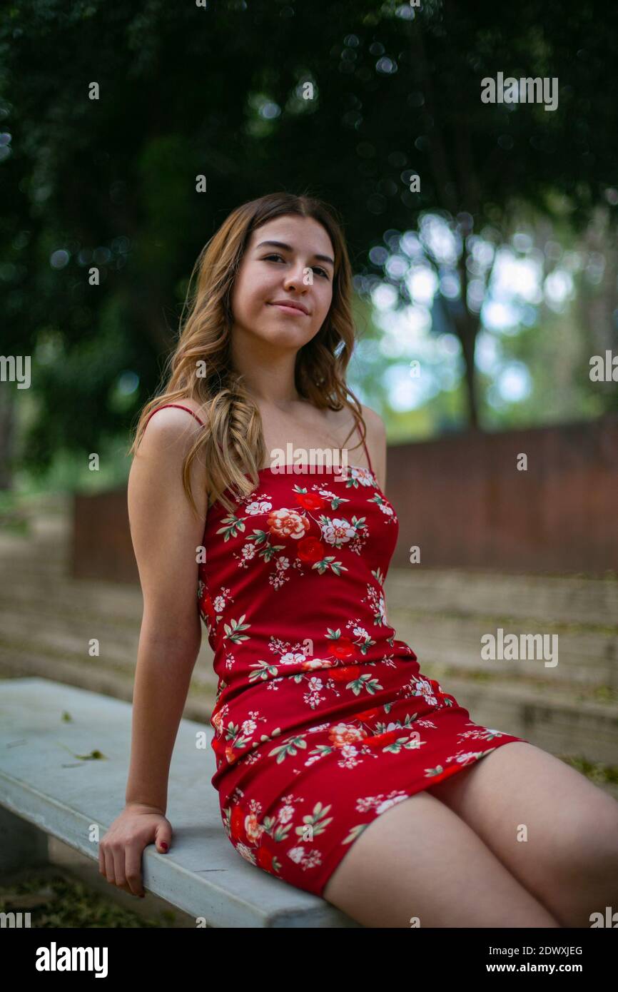 Portrait of a young woman in the park Stock Photo - Alamy