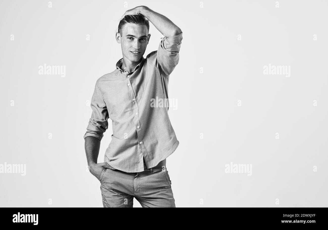 Black and white photography portrait of a man with hands behind his ...
