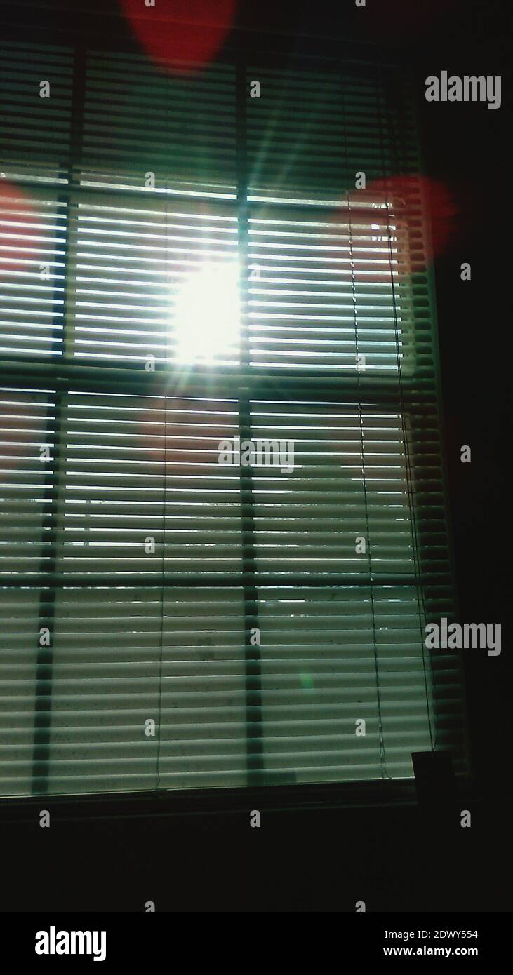 Sunlight streaming through blinds hi-res stock photography and images ...