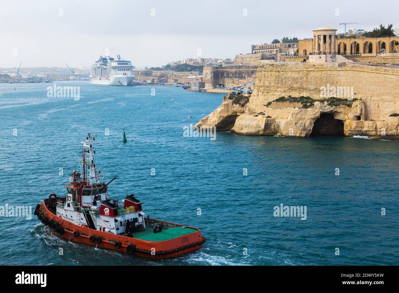 Red Lieni tugboat and Valletta city skyline with old fortification ...