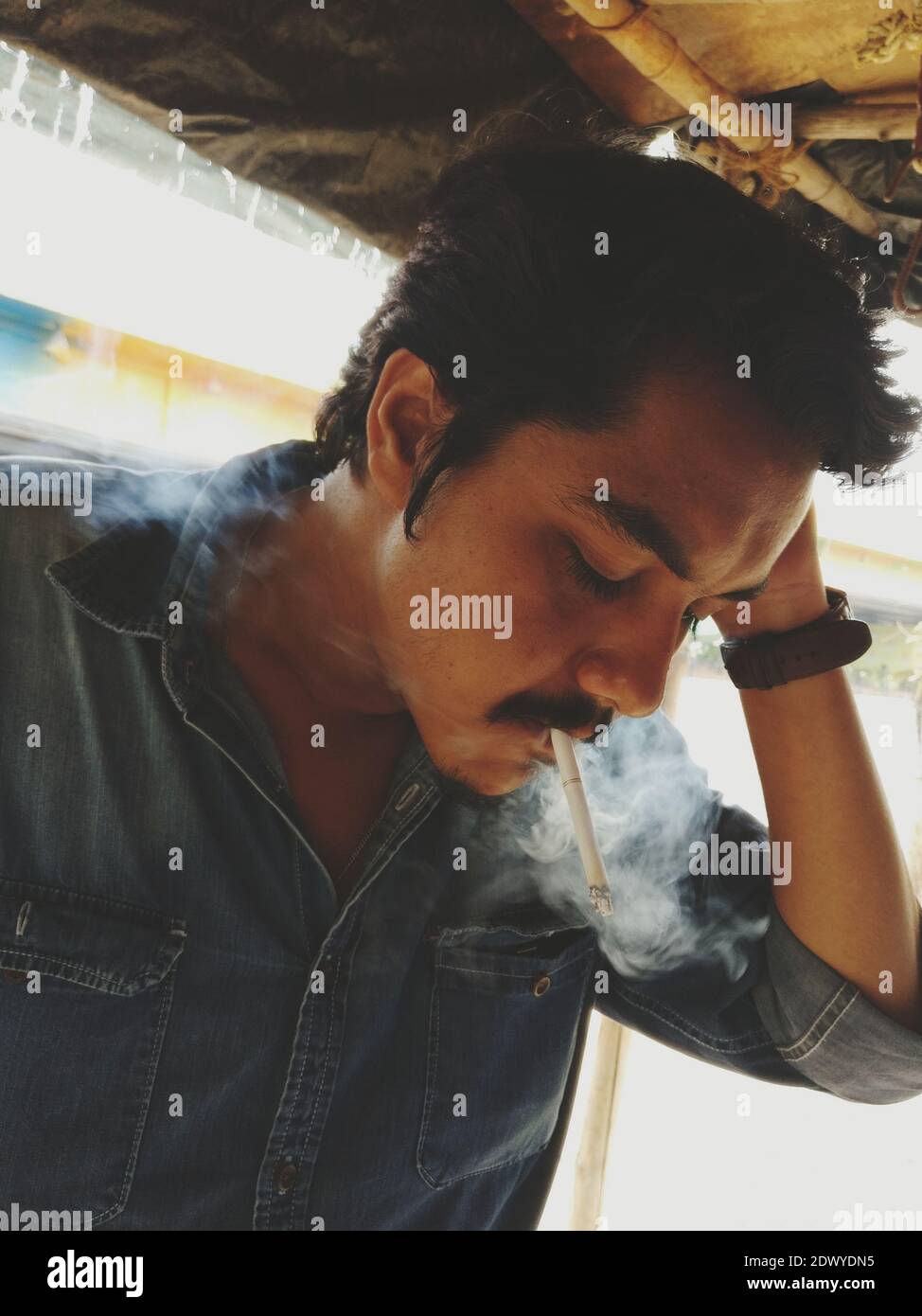 Rainy day man smoking hi-res stock photography and images - Alamy