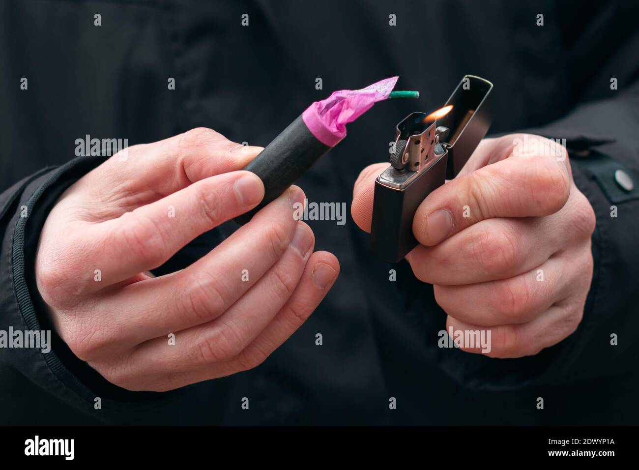 Setting Fire to the Firecracker. Man in Black Clothes Lighting Up the ...