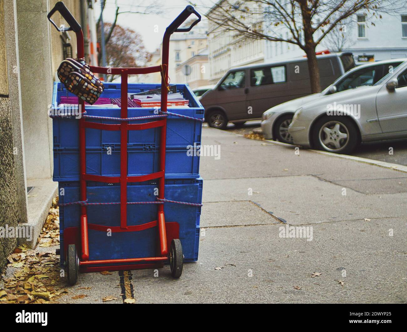 A hand truck trolley full of delivery boxes in a street Stock Photo - Alamy