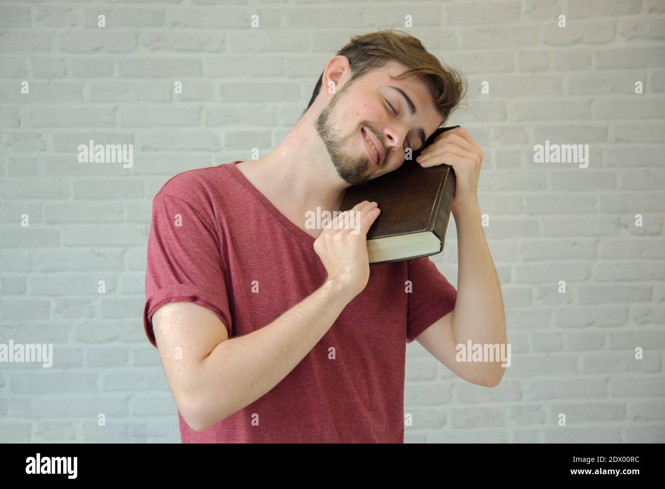 Smiling man holding bible hi-res stock photography and images - Alamy