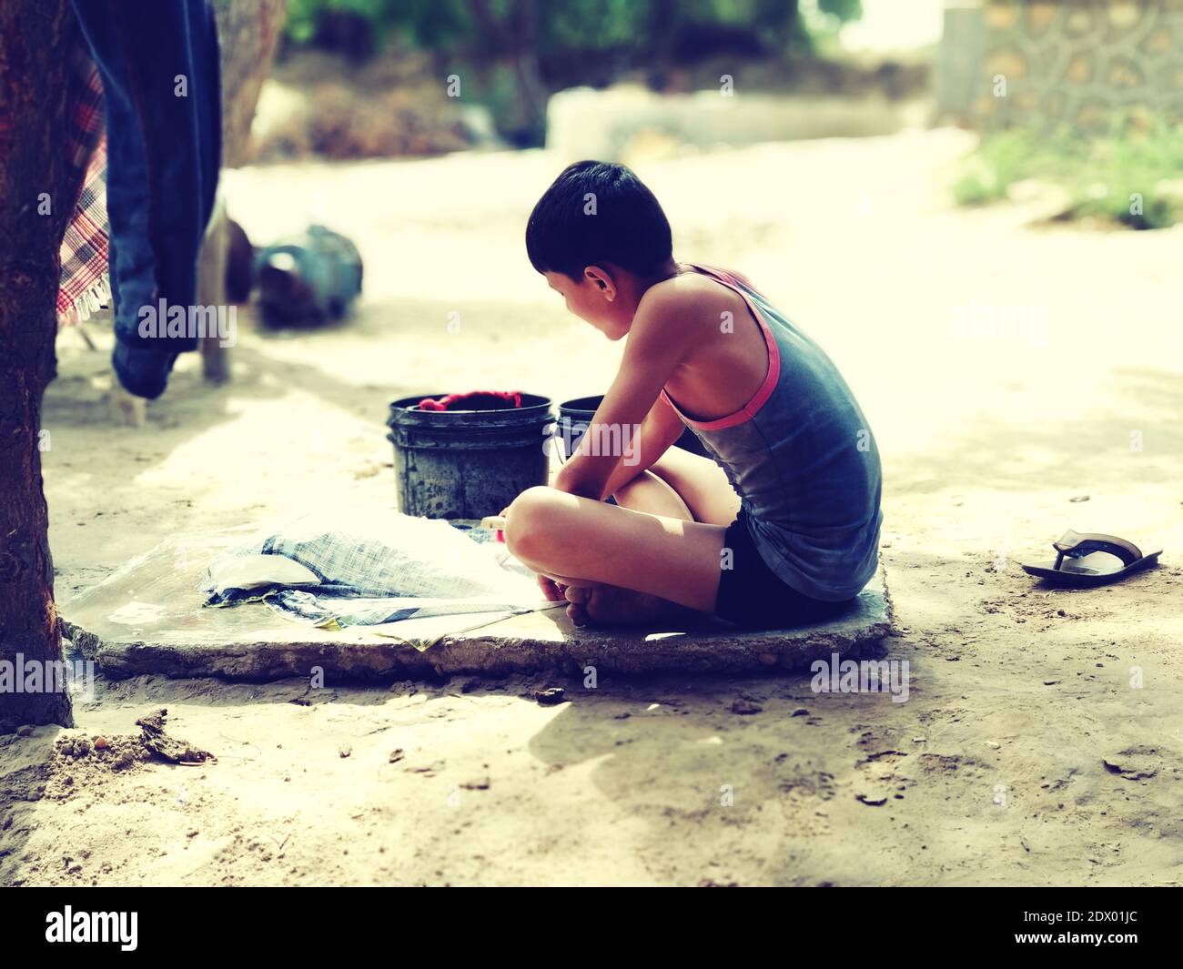 Boy Washing Clothes High Resolution Stock Photography and Images - Alamy