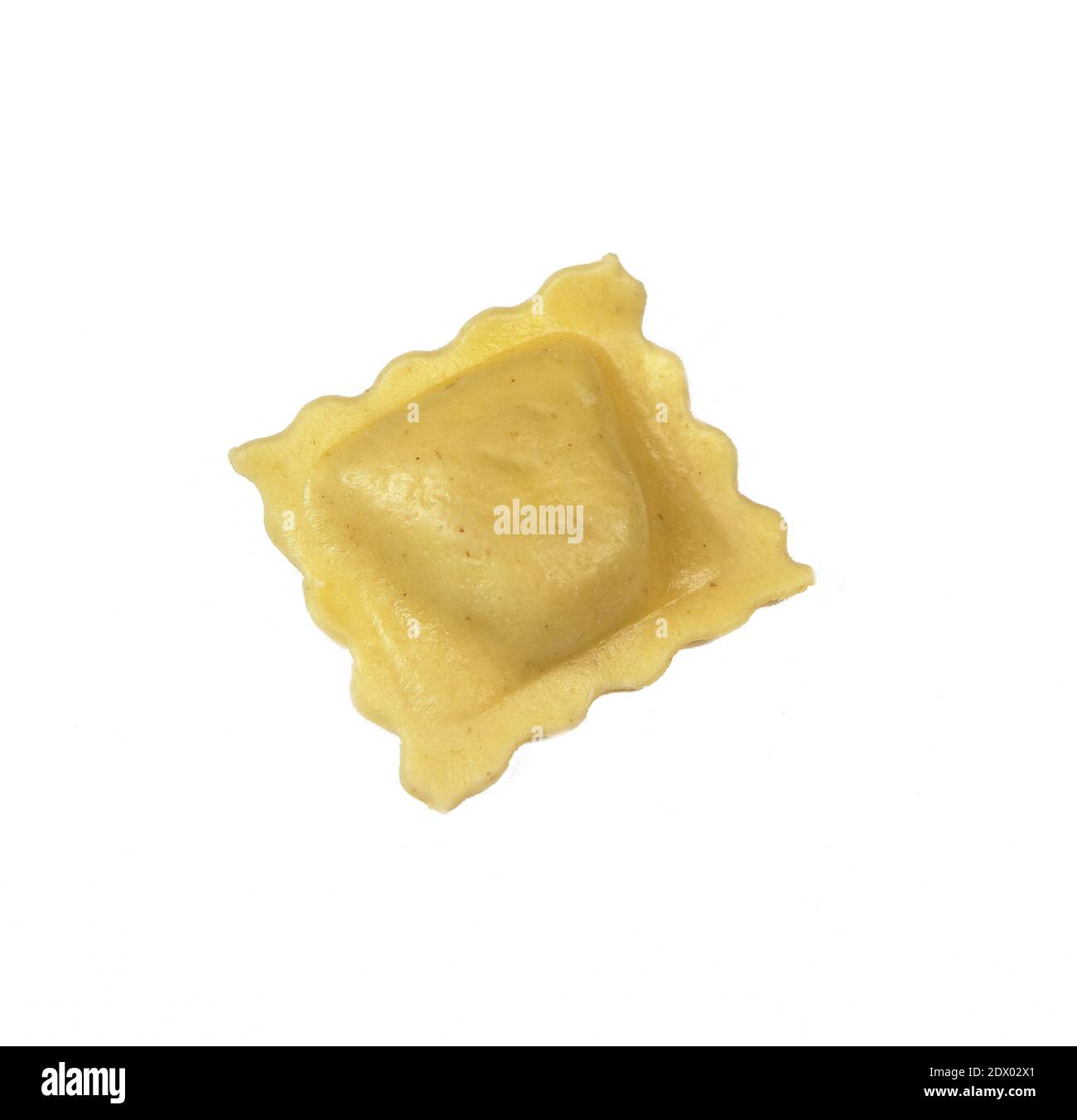 Tasty raw ravioli with flour and spinach on white background, process ...