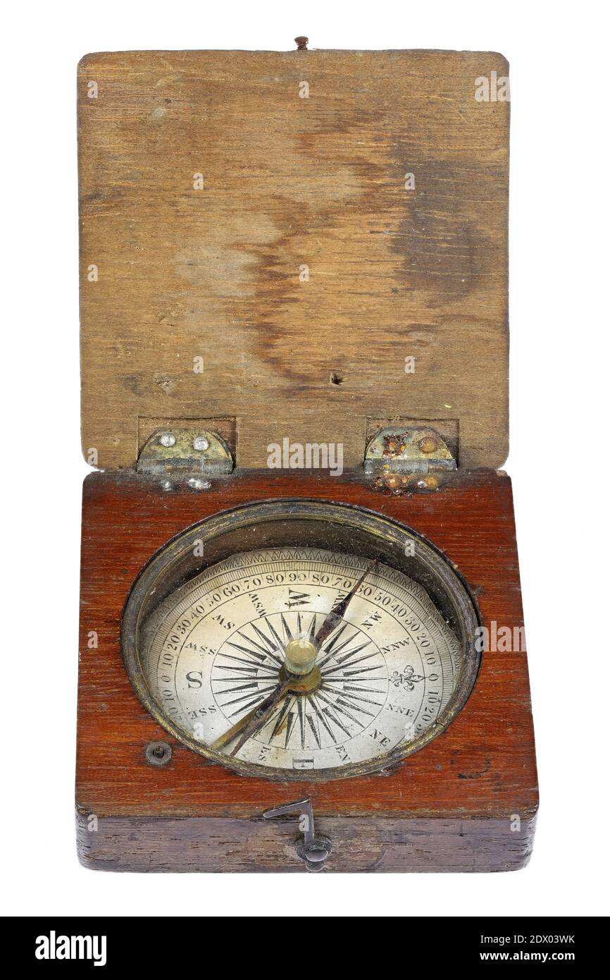 ancient portable compass in wooden case isolated on white background ...