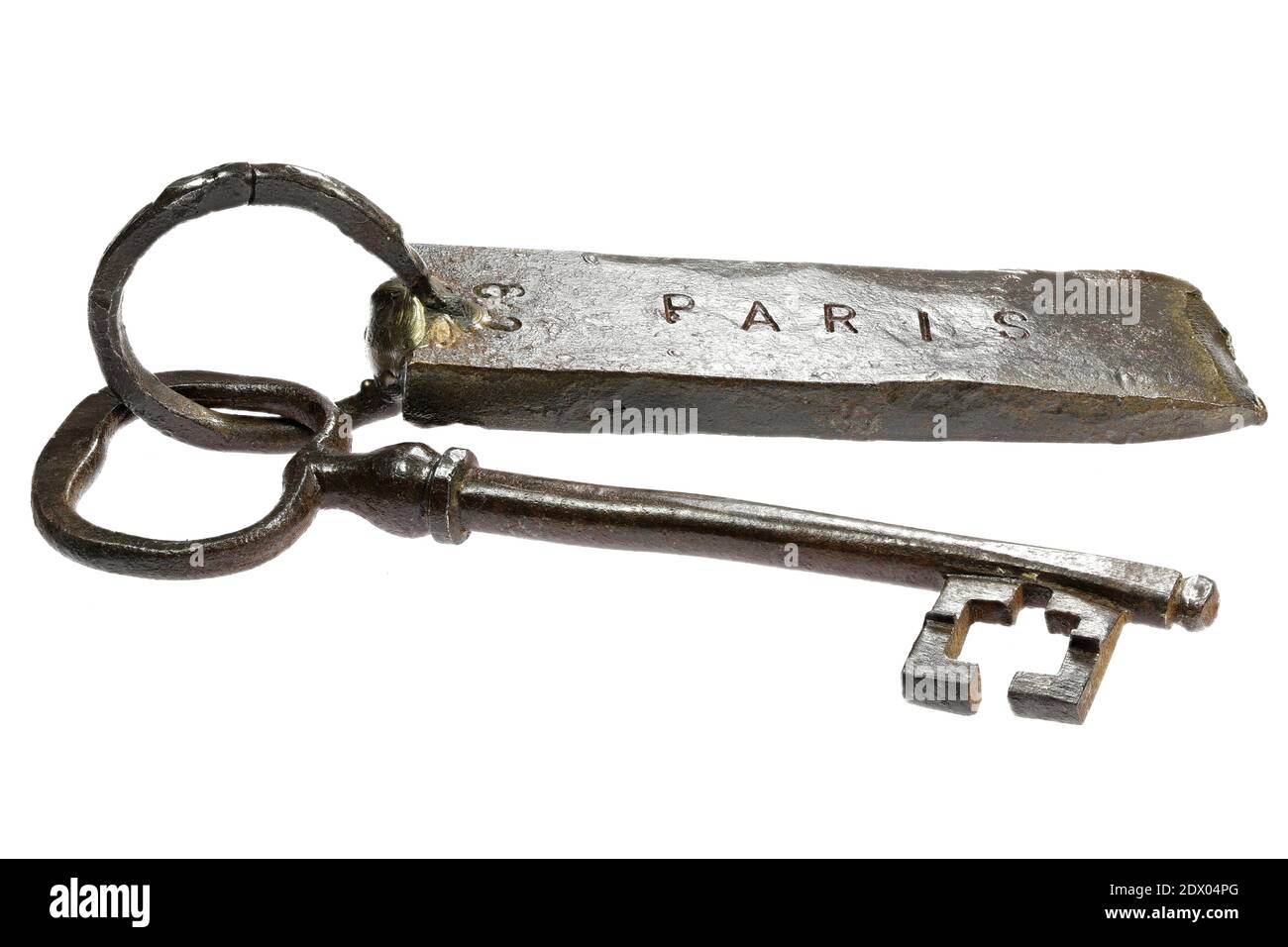 vintage hand-forged key with fob ‘PARIS’ isolated on white background ...