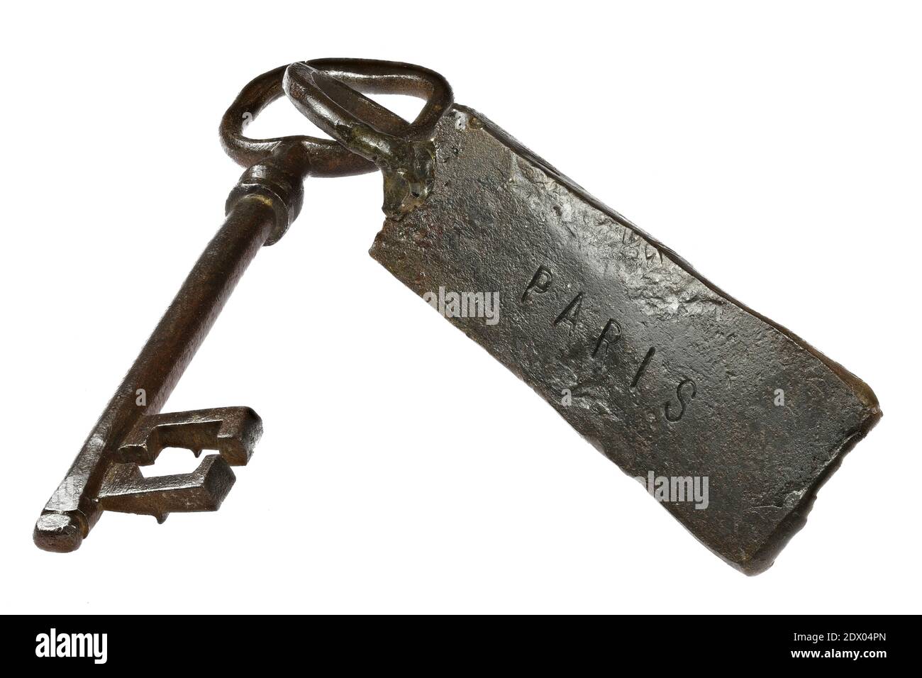 vintage hand-forged key with fob ‘PARIS’ isolated on white background ...
