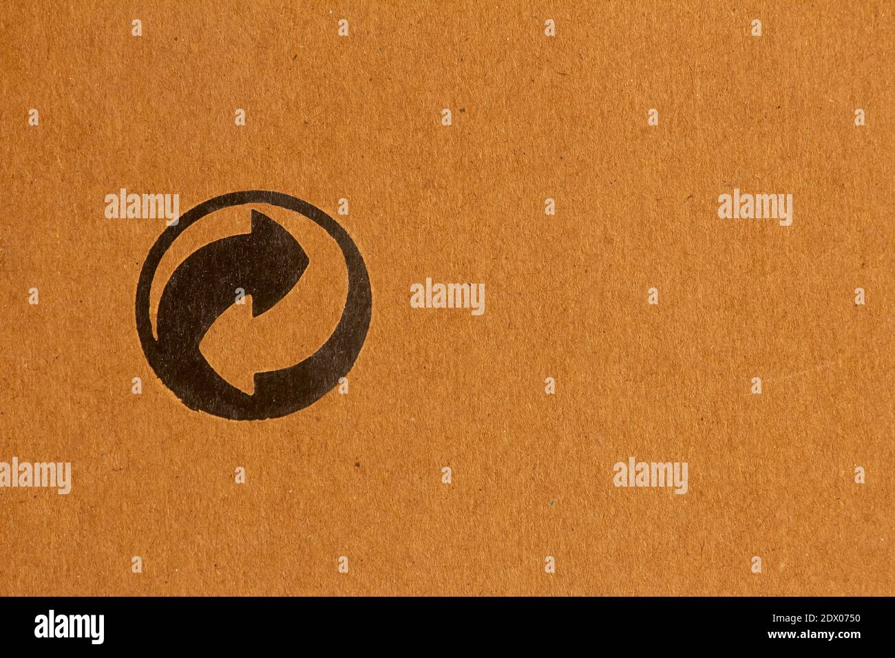 View of Recycle and reuse symbol printed in cardboard. Symbol used in ...