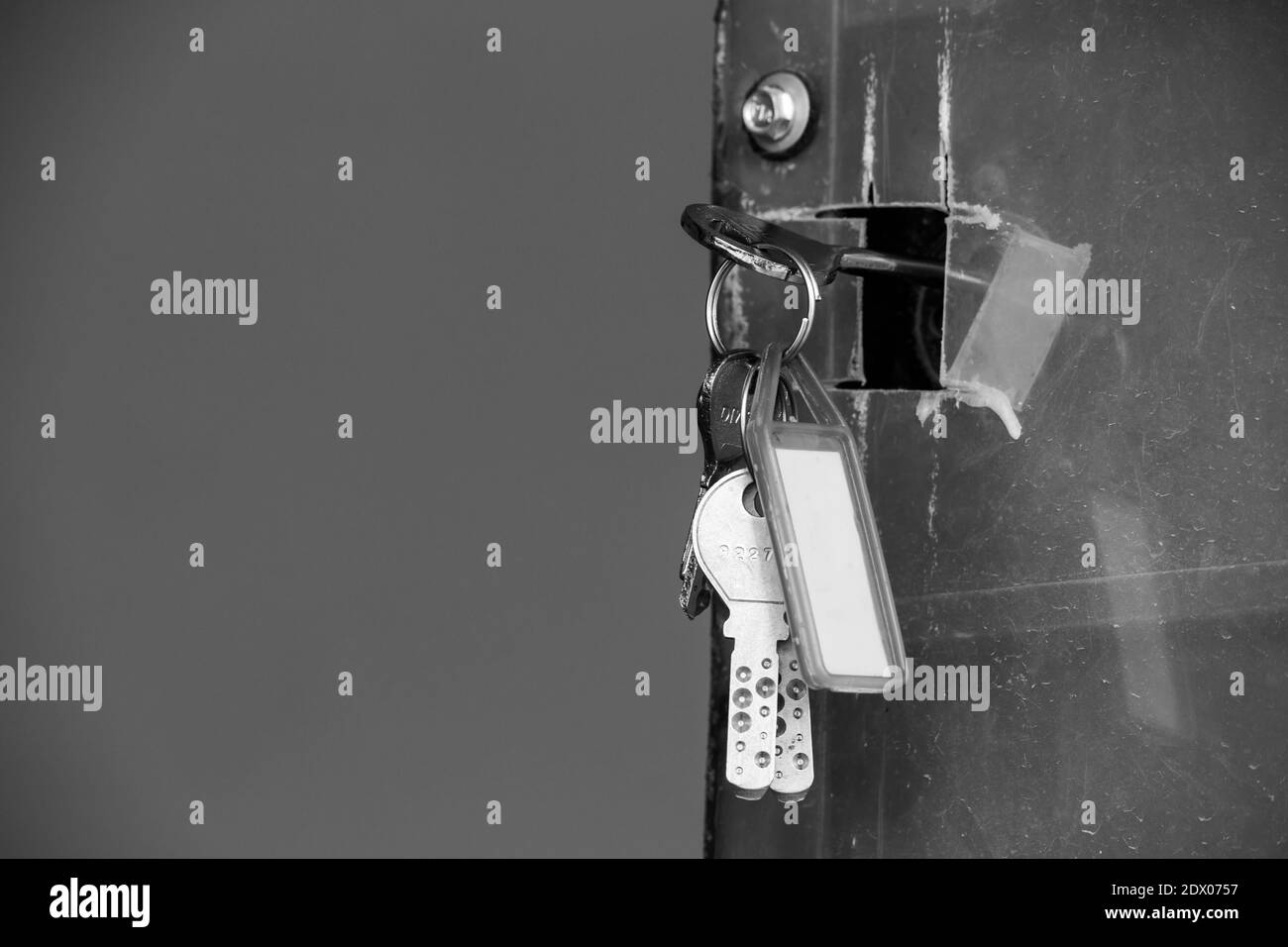 Bunch of keys hanging in a door. Door keys to open front door in home ...