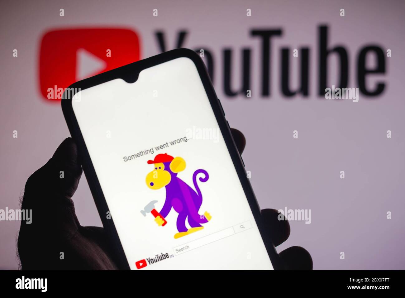 In this photo illustration a Youtube logo seen displayed on a smartphone. "Something went wrong ...