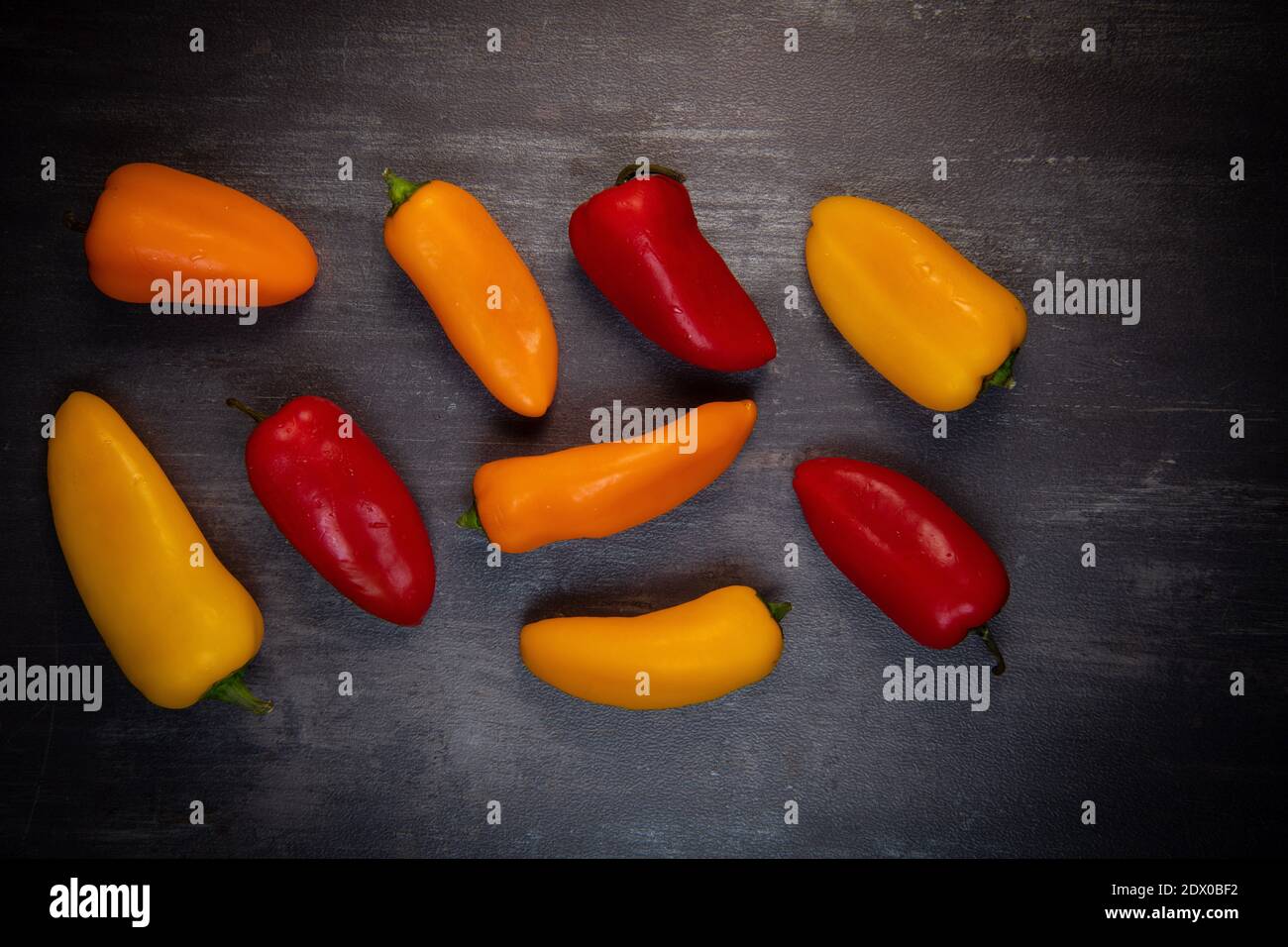 Assorted ripe multi-colored baby peppers, red, orange and yellow Stock ...