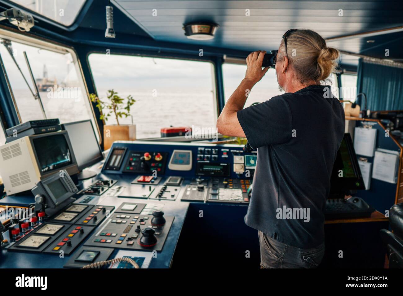 Captain Looking Through Binoculars High Resolution Stock Photography ...