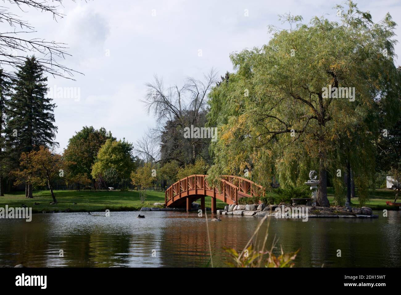 Residential building with a bridge over the pond Stock Photo - Alamy