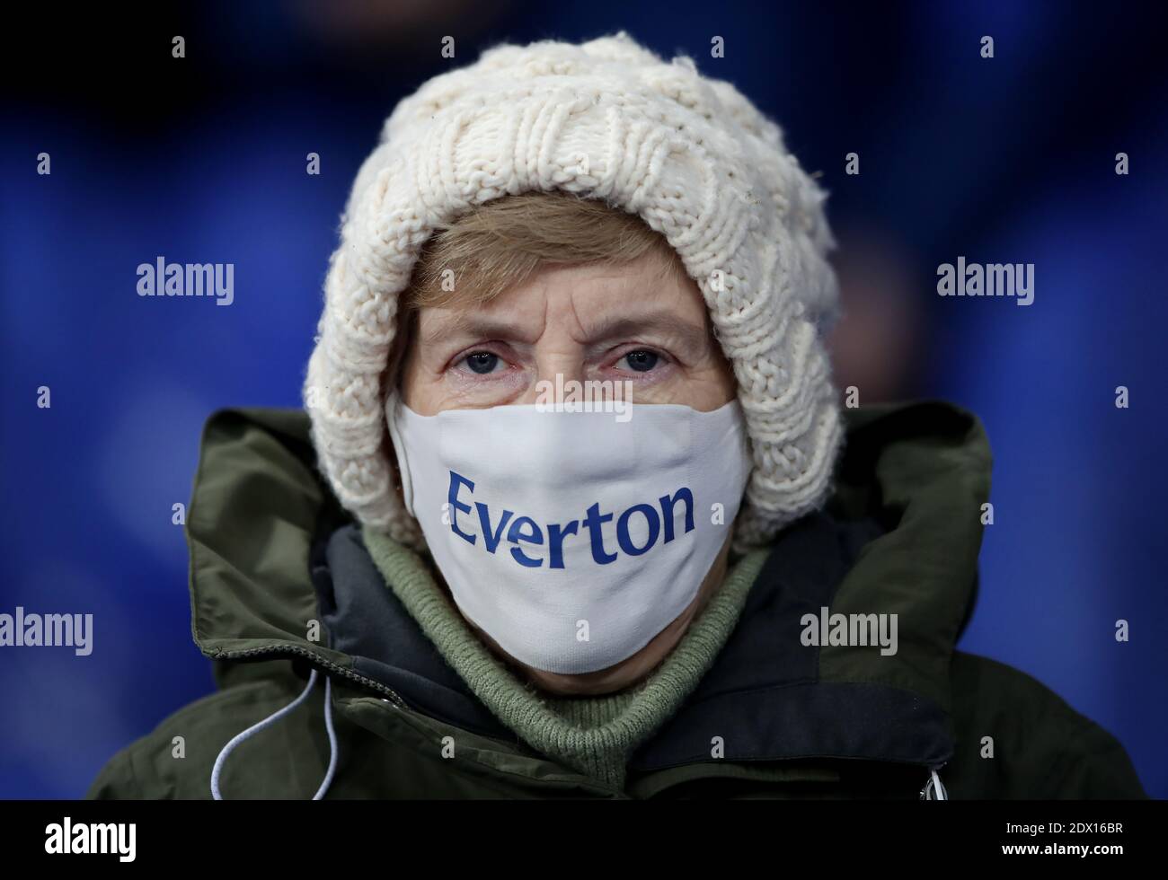 An Everton fan wearing a face mask inside the ground before the Carabao ...