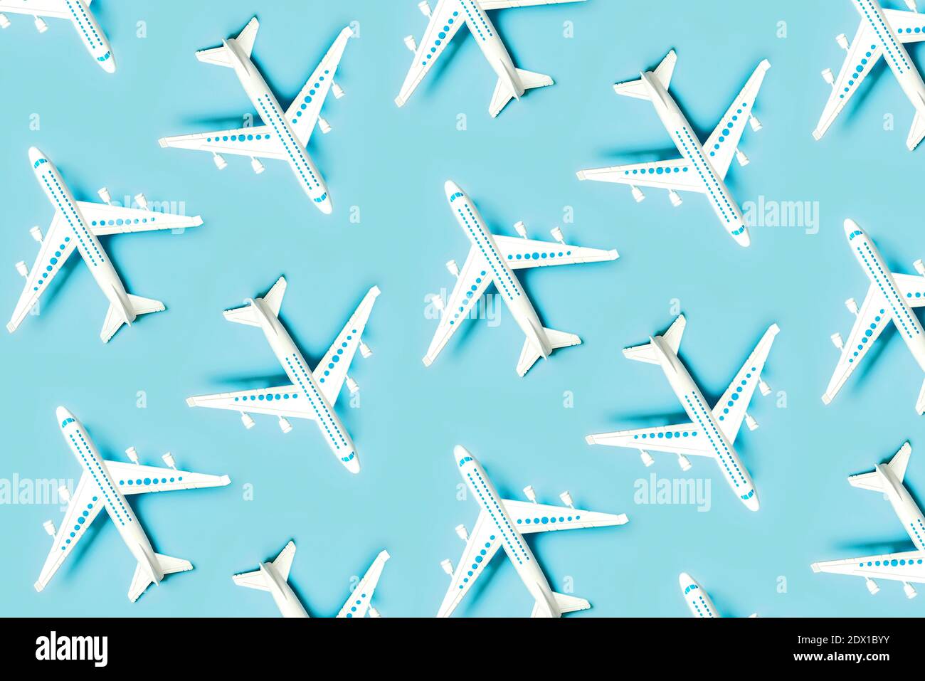 Geometric pattern made with airplane on blue background.Holidays and ...