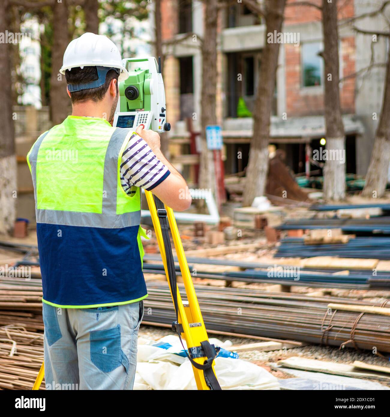 Construction topography worker on the building site Stock Photo - Alamy