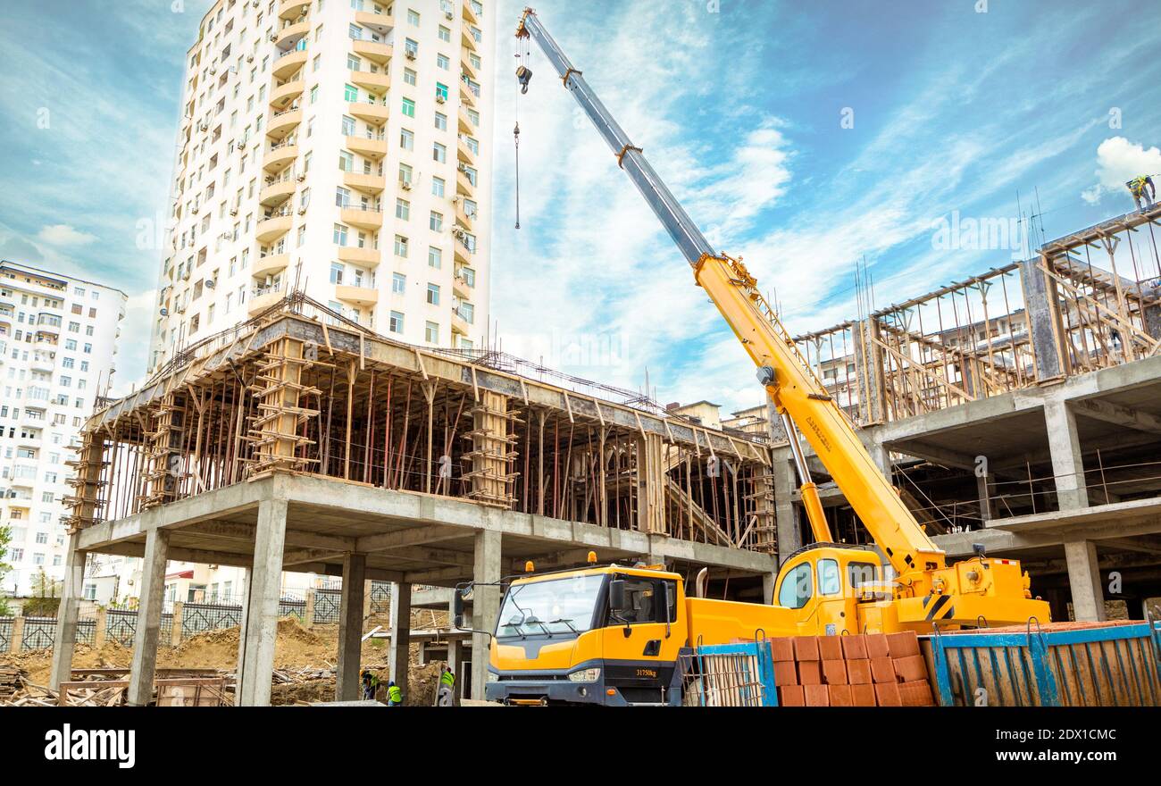Crane truck on the construction site Stock Photo - Alamy