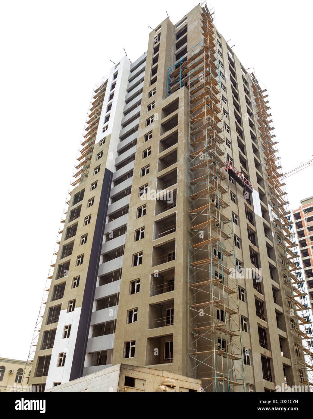 High buildings with scaffold at the construction site Stock Photo - Alamy