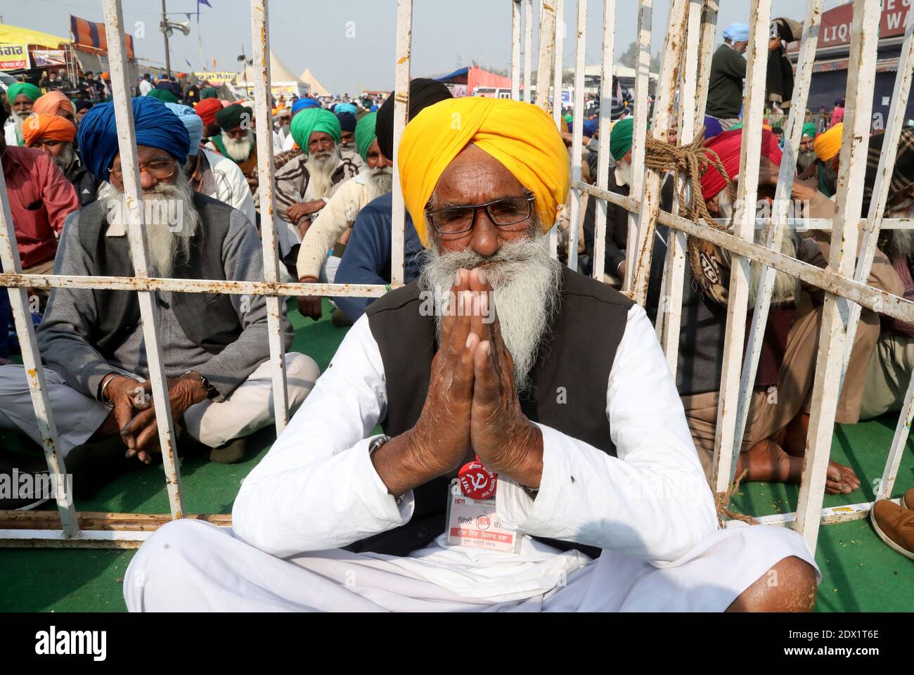An elderly Sikh protester praying at Singhu border during the ...