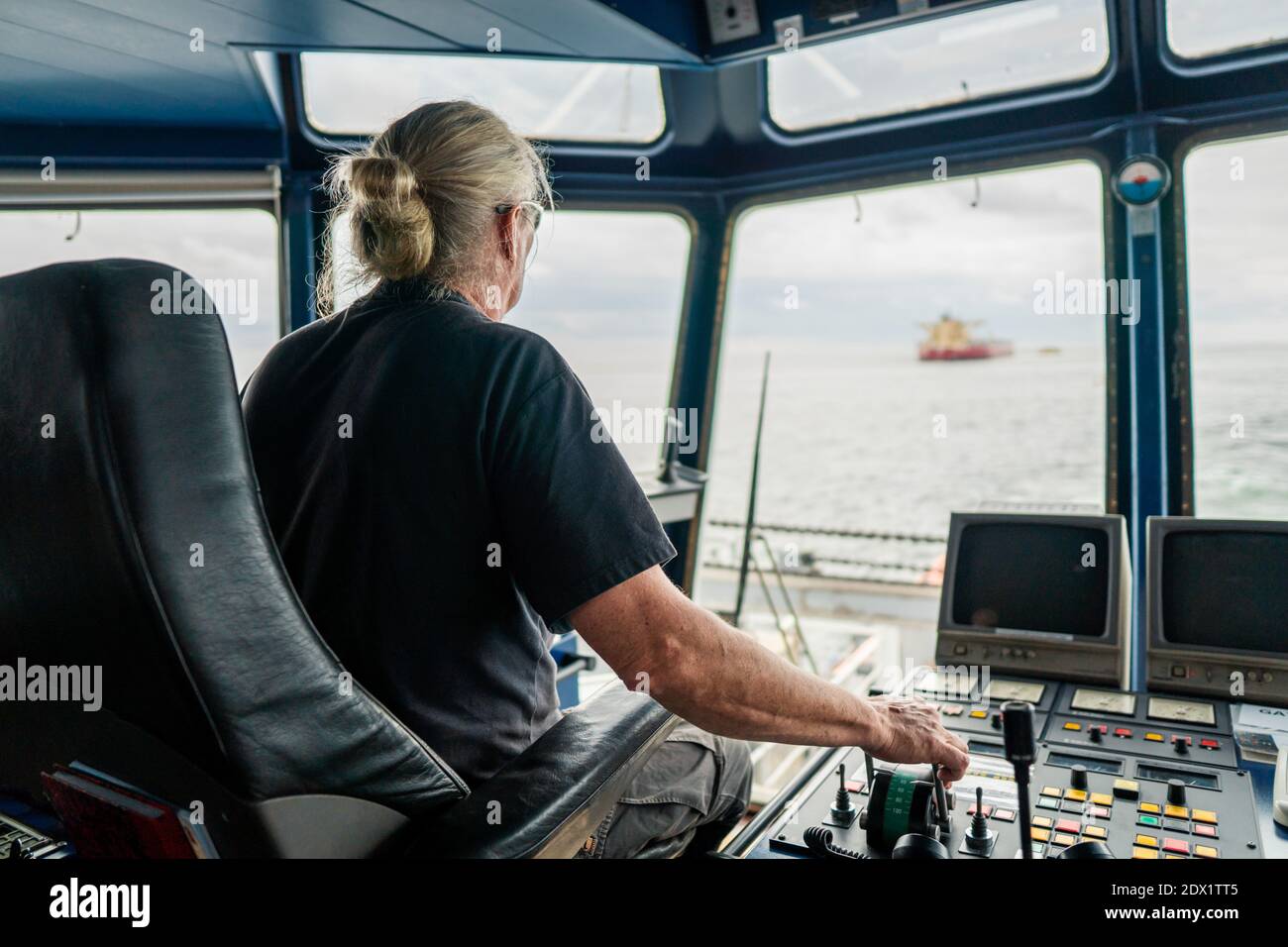 Captain of deck Officer on bridge of vessel or ship during navigaton ...
