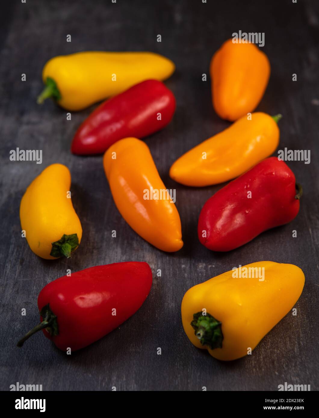 Assorted ripe multi-colored baby peppers, red, orange and yellow Stock ...