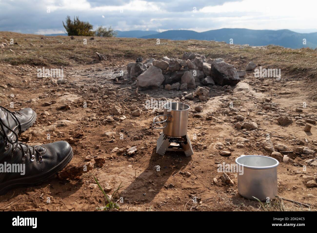 Iron, tourist mugs on an open fire during a camping trip Stock Photo ...