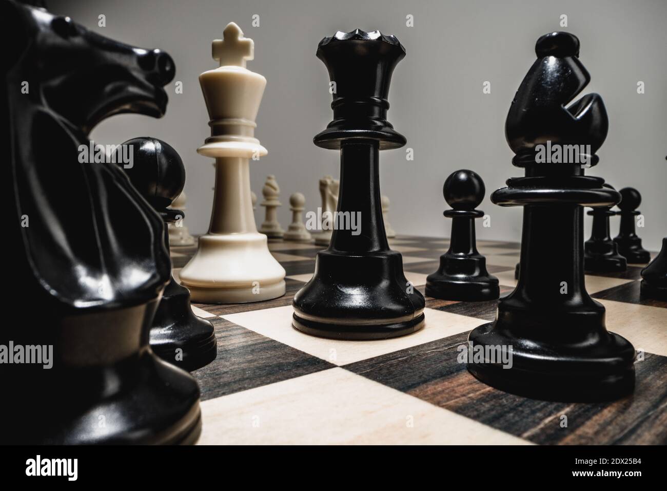 Chess figures on chess board macro photo Stock Photo - Alamy