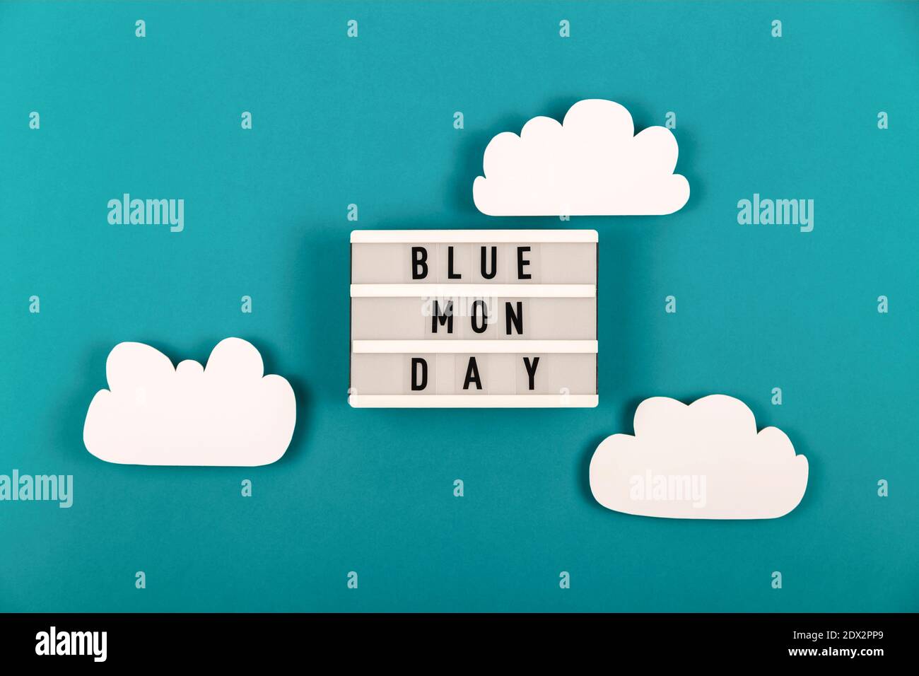 Sad blue Monday lettering with clouds around Stock Photo - Alamy