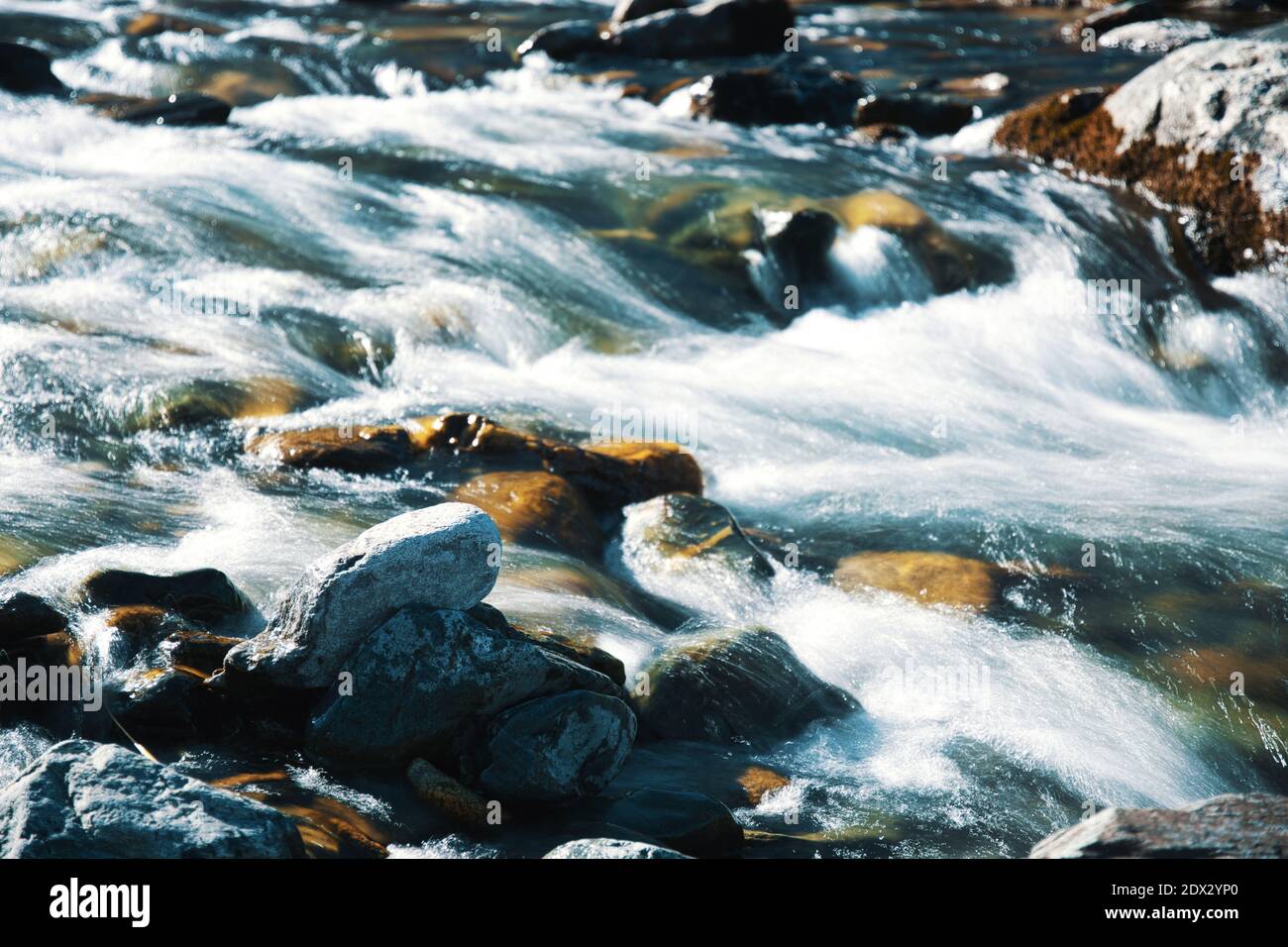Mountain river flow through rocks and stones long exposure picture at ...