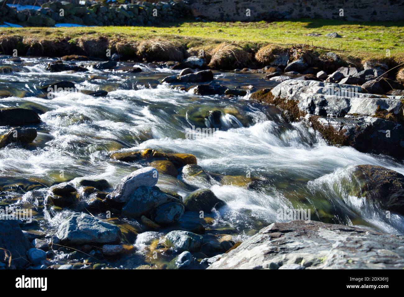 Mountain river flow through rocks and stones long exposure picture at ...