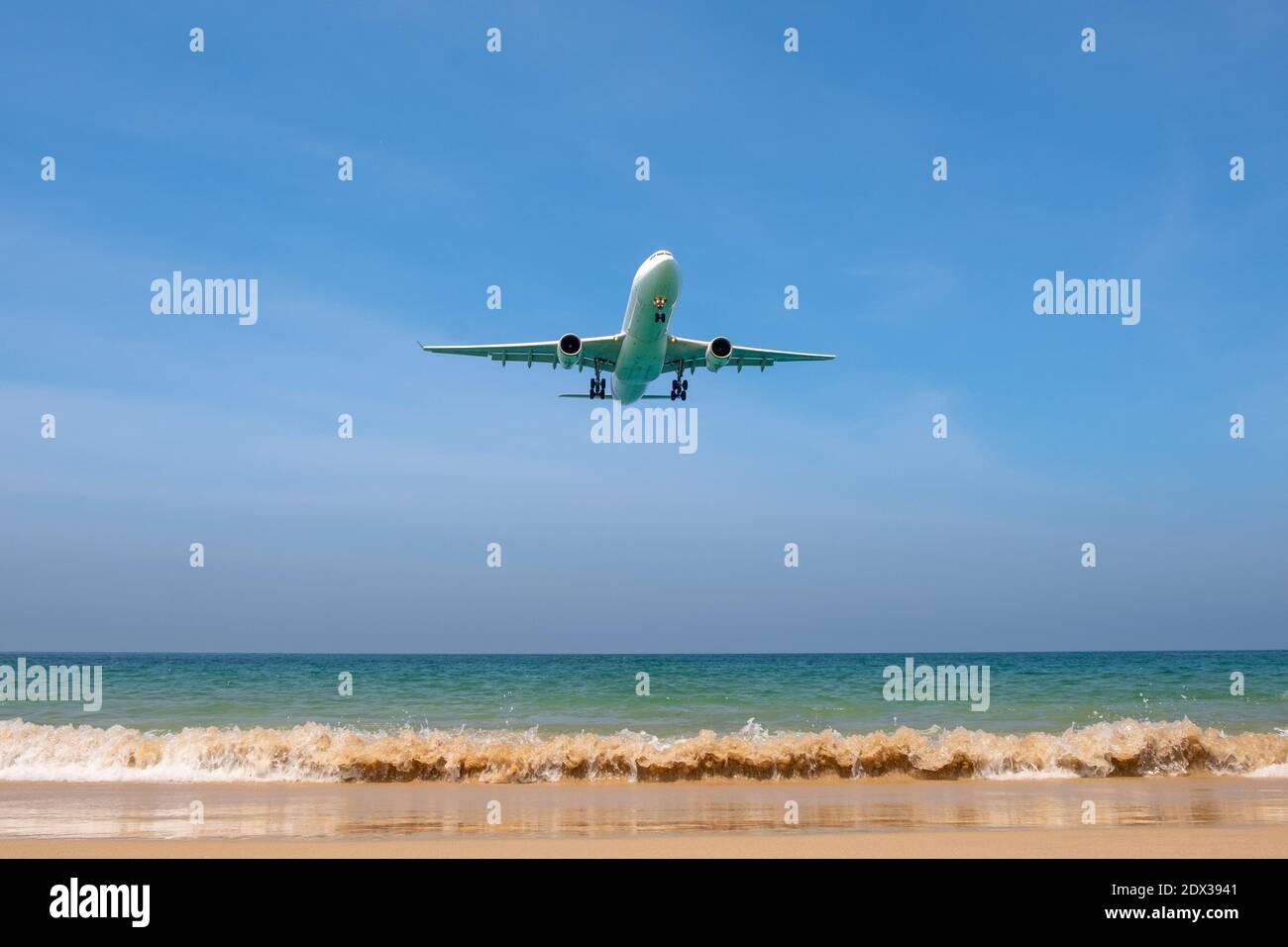 Airplane in sky sunset over ocean hi-res stock photography and images ...