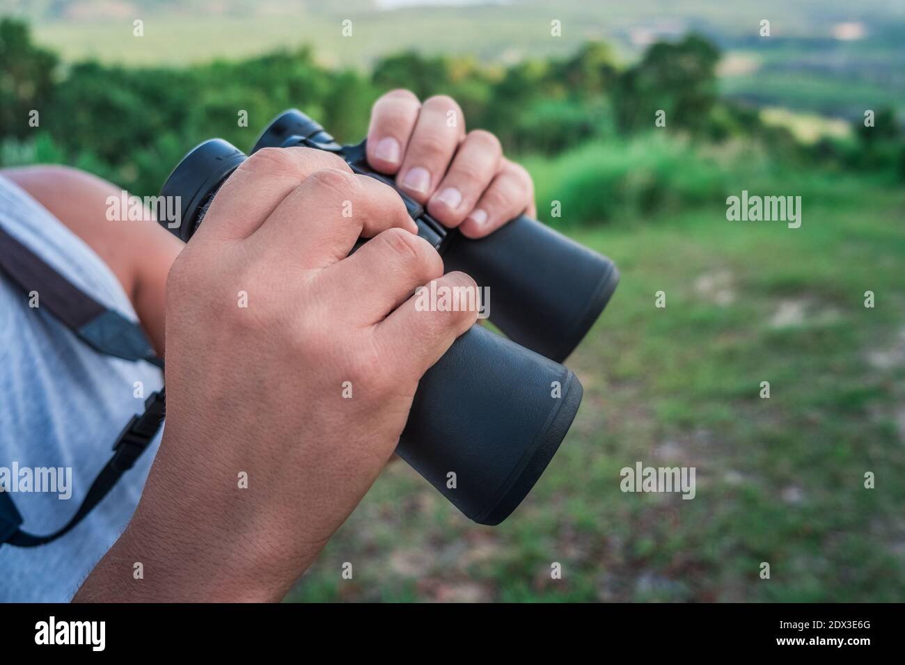 Binoculars in hand hi-res stock photography and images - Alamy