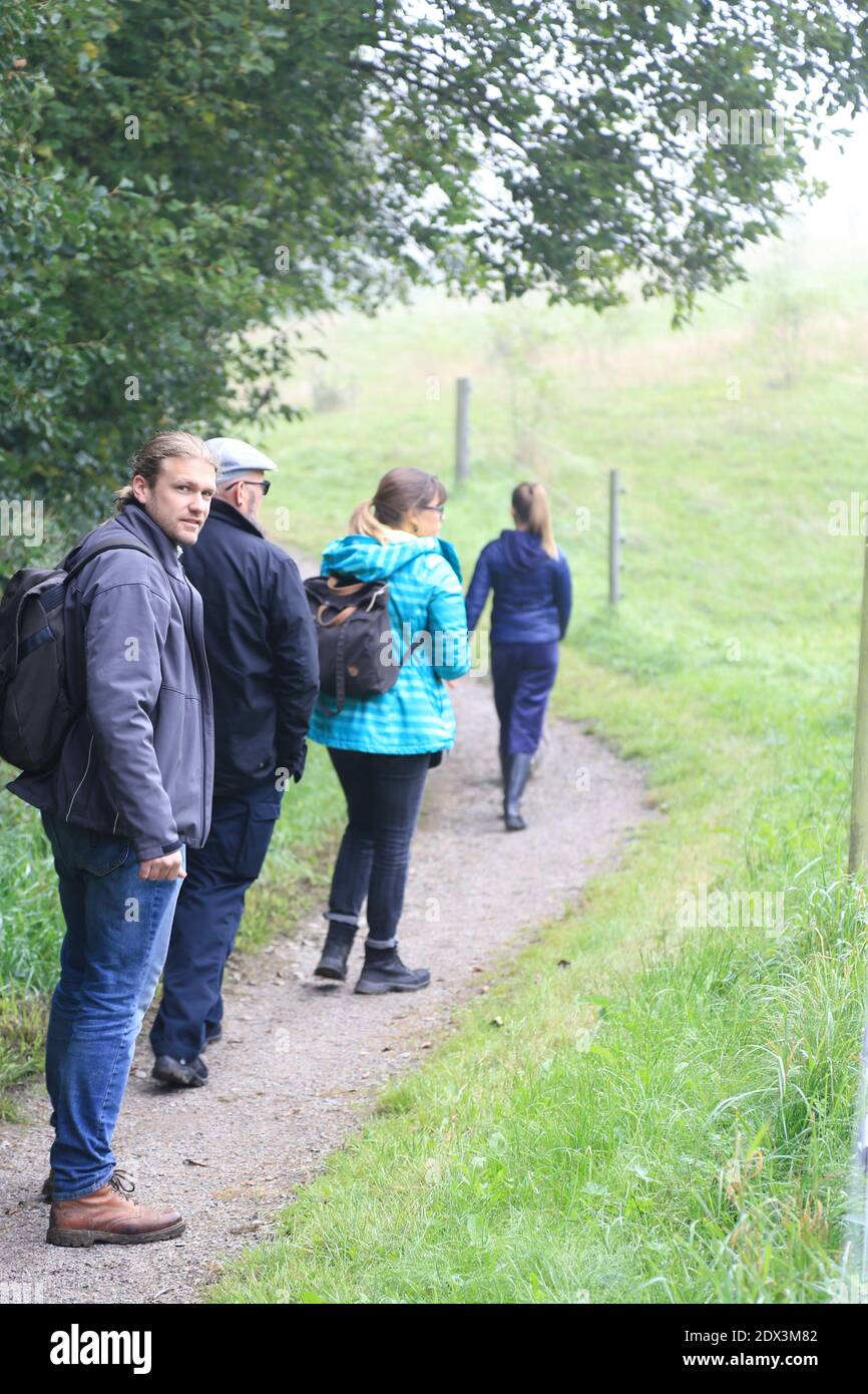 People Walking On Footpath Stock Photo - Alamy