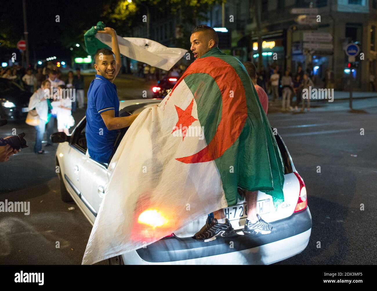 Algeria soccer fans watch in a bar their national team match against ...