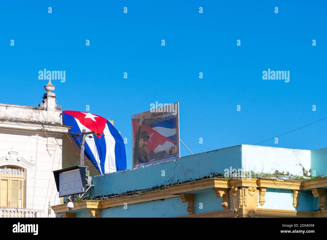 Cuban flag and image of Fidel Castro in Santa Clara, Cuba Stock Photo ...