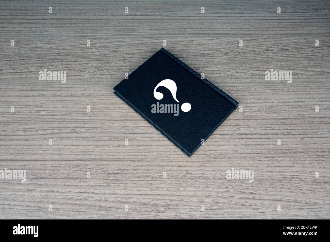 Question mark on book hi-res stock photography and images - Alamy