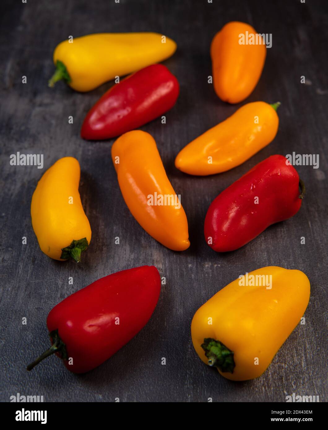 Assorted ripe multi-colored baby peppers, red, orange and yellow Stock ...