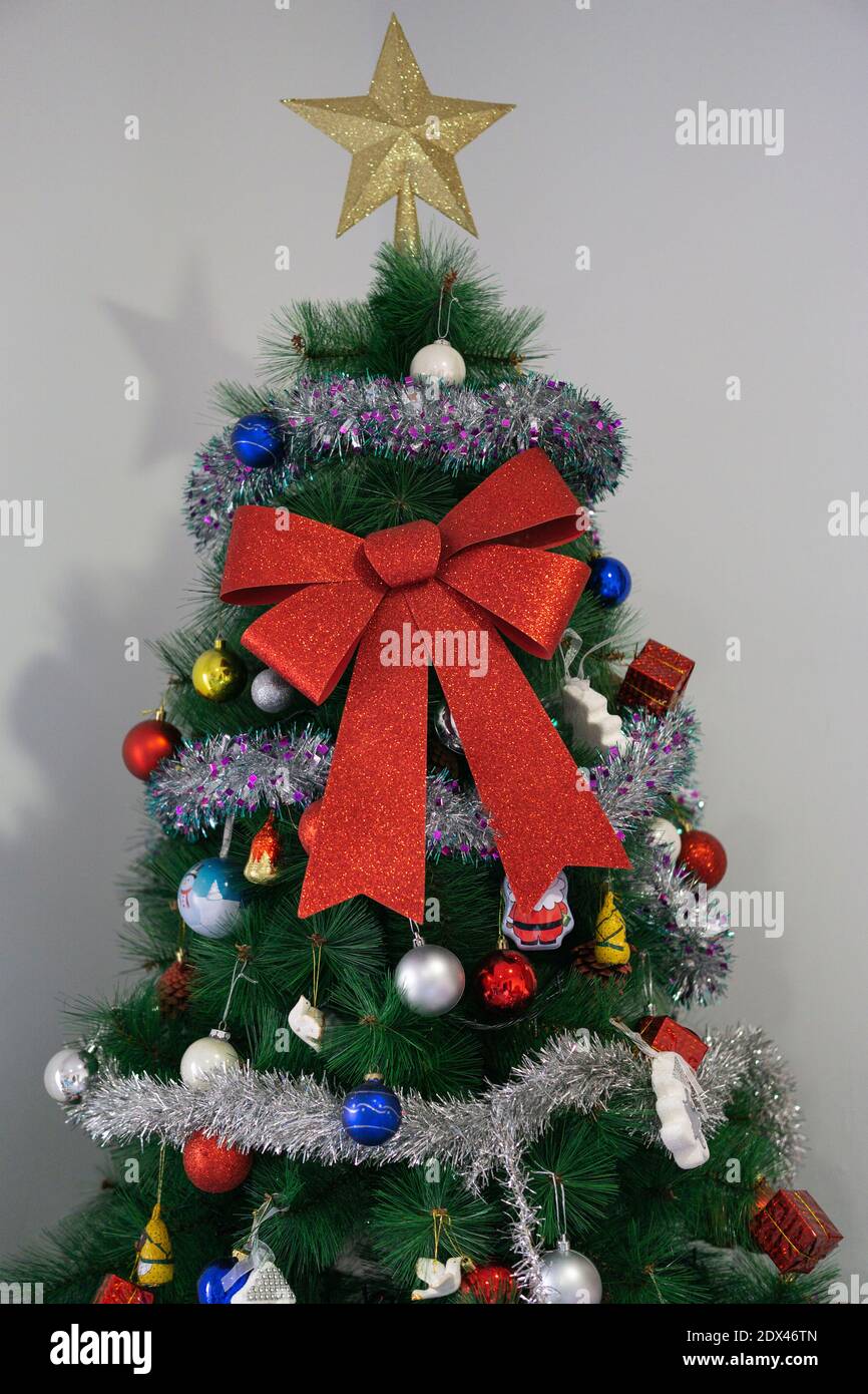 christmas tree with big bow Stock Photo - Alamy