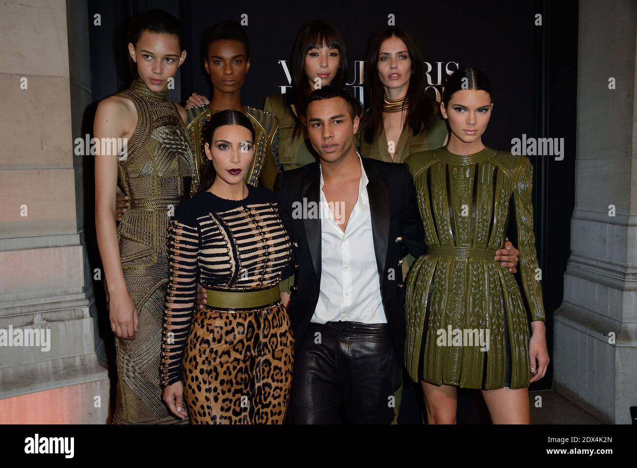 Olivier Rousteing poses with Kim Kardashian and her sister Kendall ...