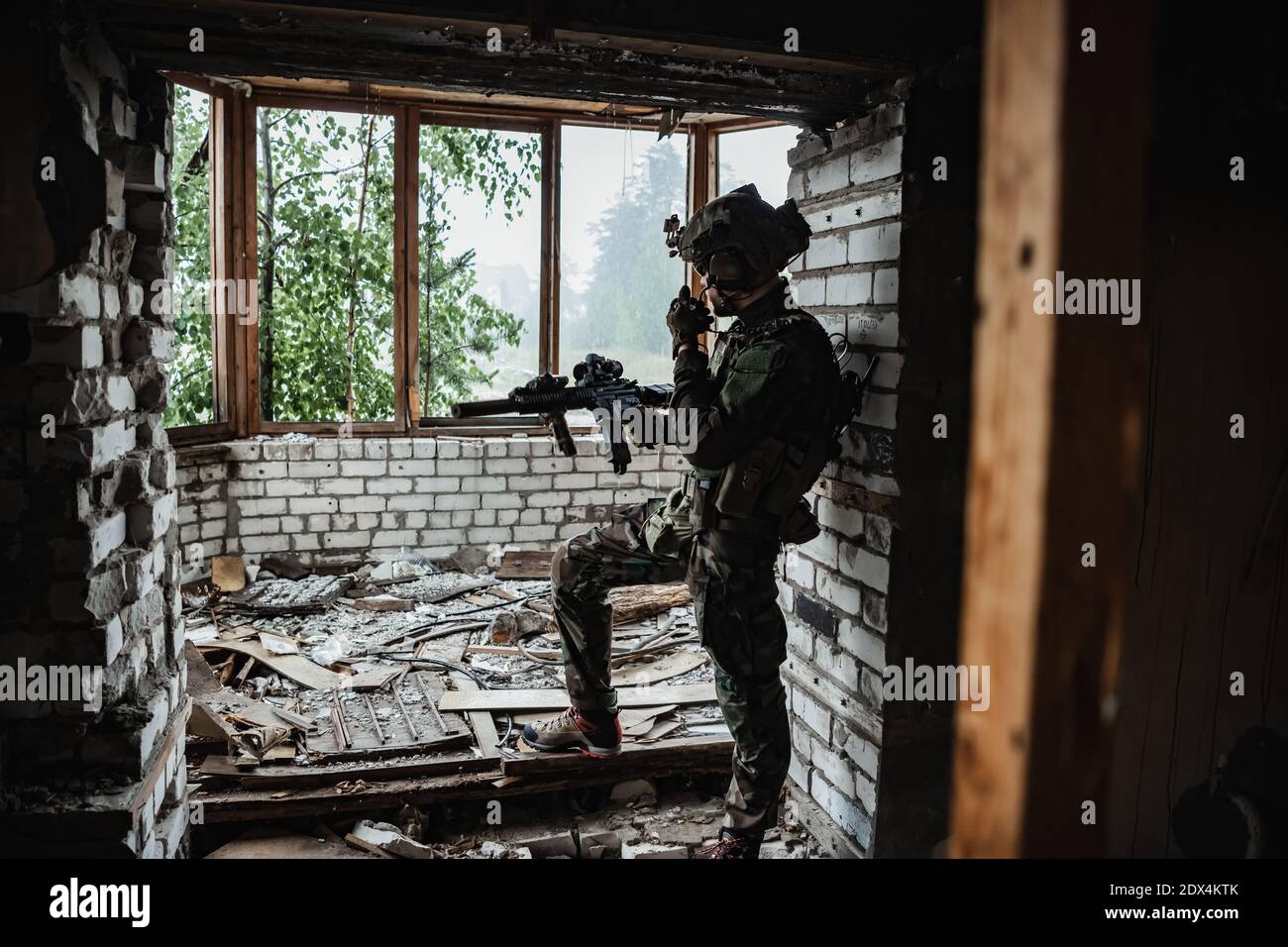 Weapon inspection while waiting on a spot. Military man checks his ...