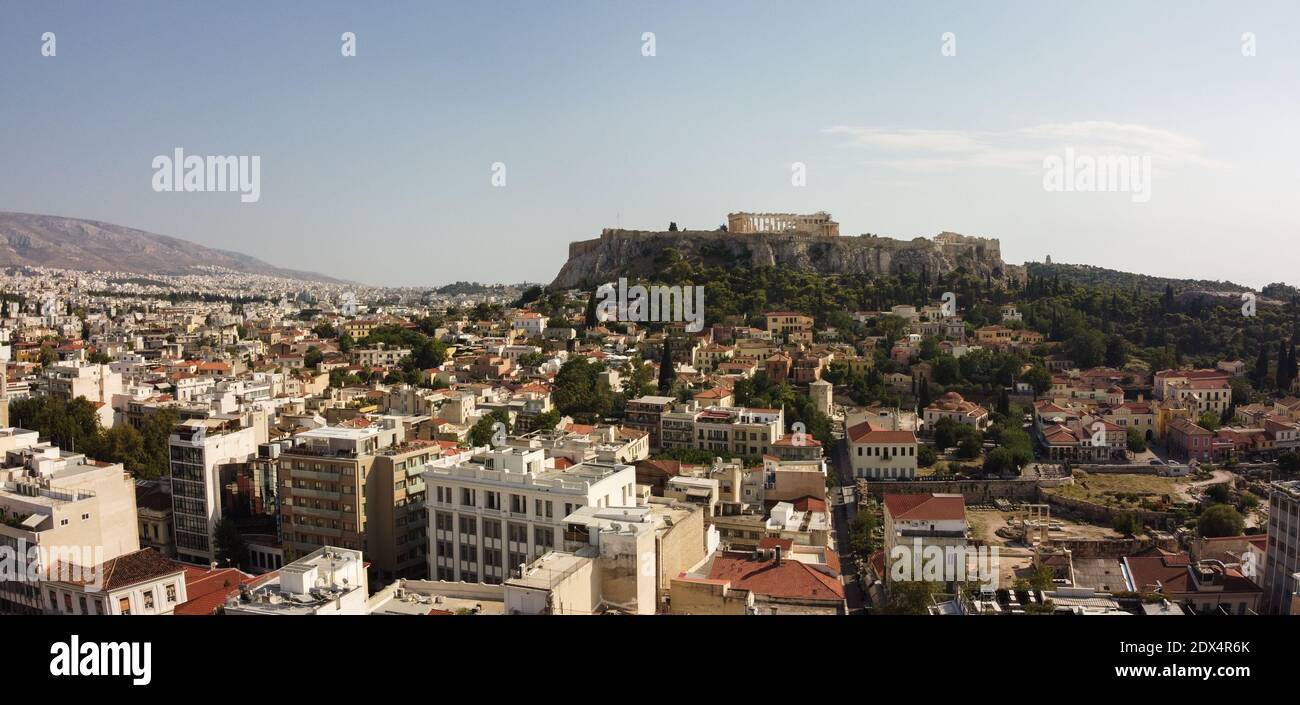 Aerial tilt up shot of Athens city buildings and Acropolis Architecture ...
