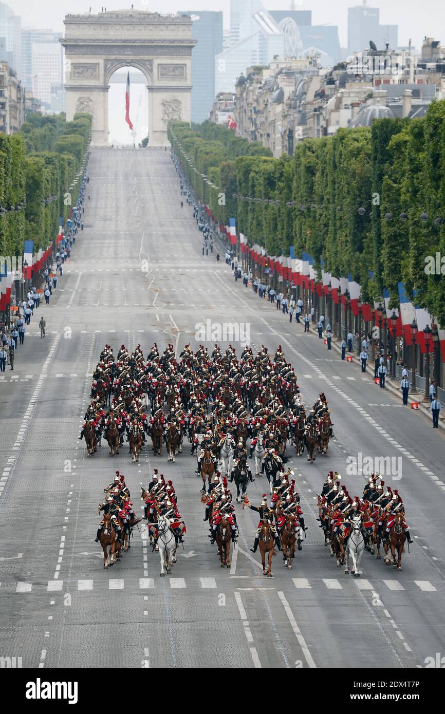 The Republican Guards ride down the Champs-Elysees avenue during the ...