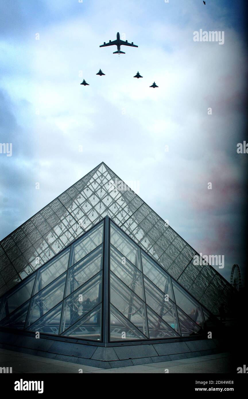 Planes are flying over Le Louvre Pyramide prior to the annual Bastille ...