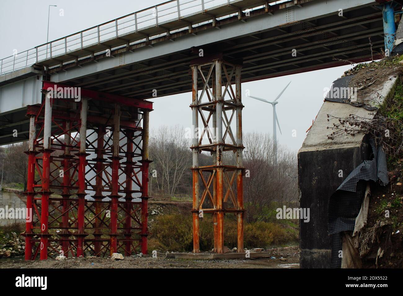 A view of old metal pile under a bridge on a foggy day Stock Photo - Alamy