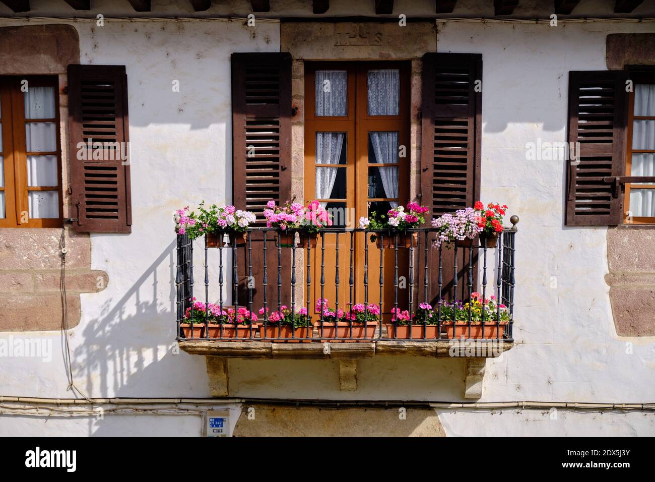 Typical spanish Basque upper floor door with balcony decorated with ...
