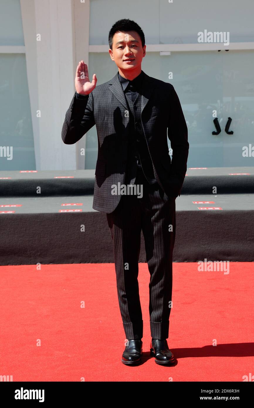Tong Dawei attending the Qin'Ai De Premiere during the 71st ...