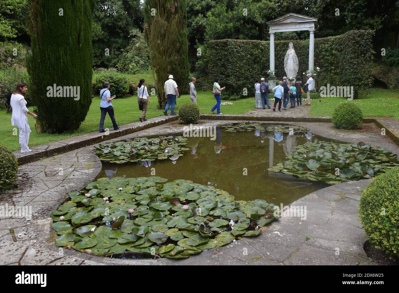 Tourists visit the papal gardens of the pope's summer residence of ...